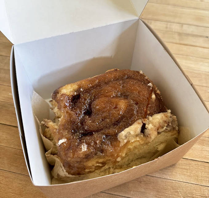 Behold the sticky bun in all its caramelized glory, glistening like a small, delicious sunset you can eat.