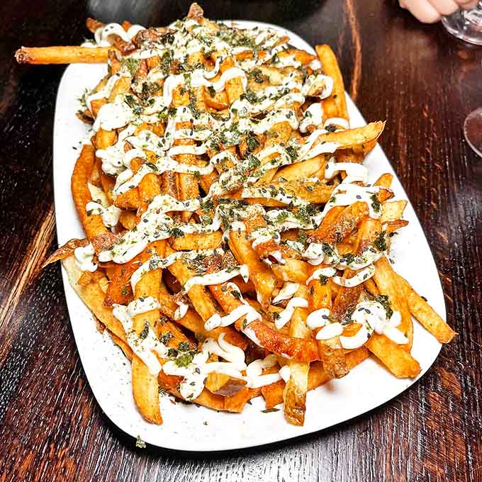 Hurricane Fries aren't just a side dish &ndash; they're a main event. Crispy potatoes drizzled with aioli and sprinkled with Japanese togarashi create flavor fireworks.