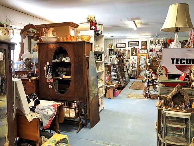 Wooden wardrobes and vintage furnishings create narrow pathways through history, each turn revealing new possibilities for discovery.