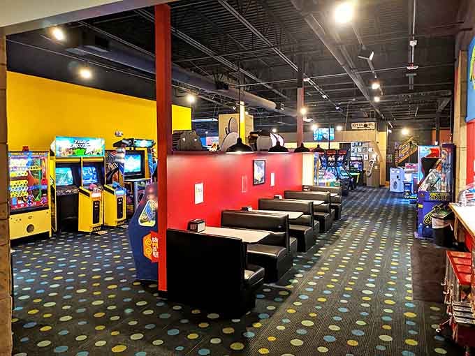 Arcade heaven meets retro-futuristic playground in this buzzing entertainment hub where quarters disappear faster than diet resolutions in December.