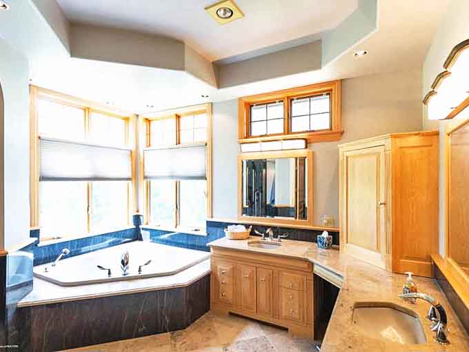 Luxury meets nature in this spa-like bathroom, where soaking in that corner tub with Superior views might be your new definition of heaven.
