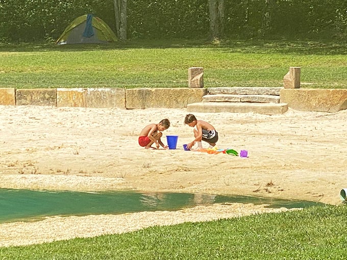 Building sandcastles with the kind of focus usually reserved for actual construction projects, these kids have their priorities absolutely right.