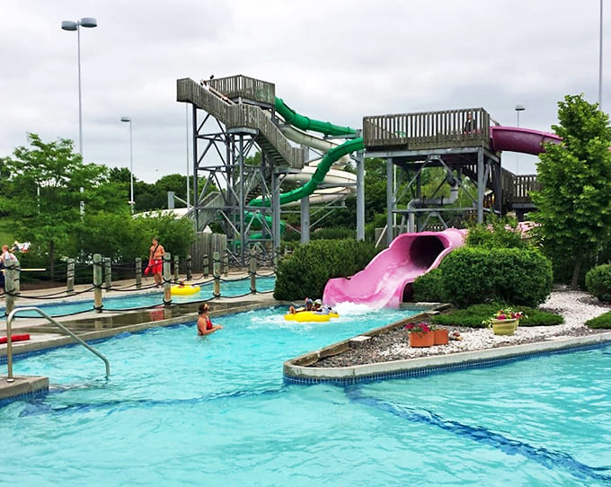 Where gravity meets giggles &ndash; the slide exit point where dignity is temporarily suspended in favor of pure joy.