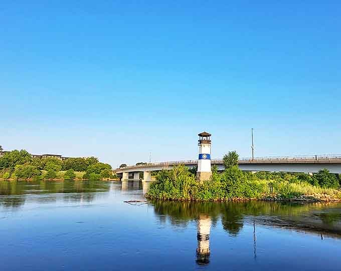 Lush summer greenery embraces the lighthouse, creating a peaceful oasis just minutes from downtown Minneapolis.