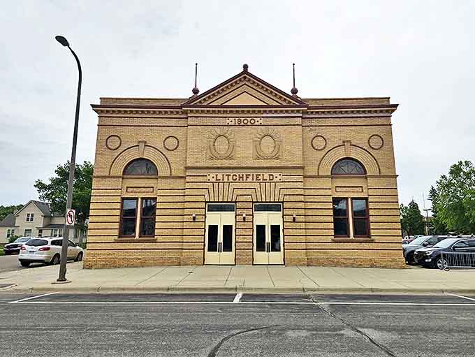 The Litchfield Opera House stands proudly on Main Street, its 1900s architecture whispering stories of vaudeville acts and community gatherings from a bygone era.