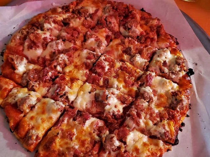 This meat lover's pizza doesn't just have toppings &ndash; it has a generous blanket of savory delights that makes vegetarians question their life choices.