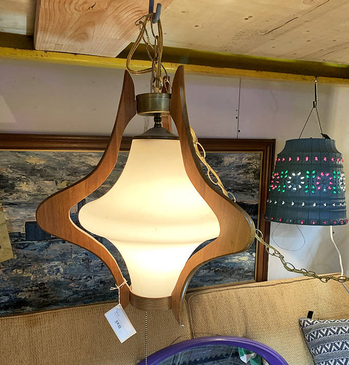 This stunning Danish Modern swag lamp combines wood and glass in a sculptural form that would make any mid-century enthusiast weak at the knees.