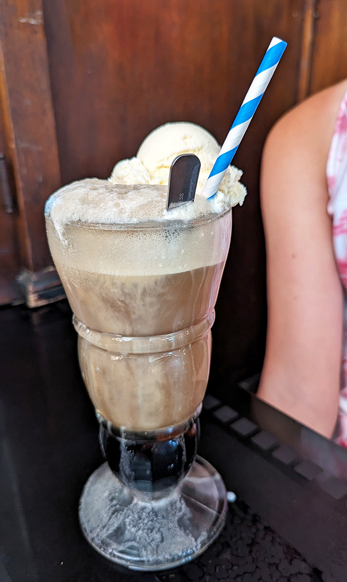 Behold the root beer float in its natural habitat, served in proper glassware because some traditions deserve respect and plastic cups deserve exactly none.
