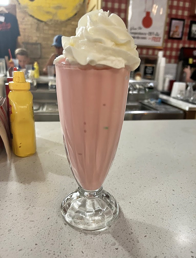 This strawberry shake isn't just pink perfection &ndash; it's a velvety time machine that transports you straight back to simpler days.