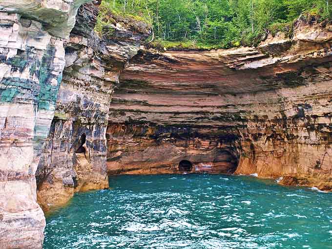 Aquamarine mystery: This sea cave near Pigeon River showcases nature's patient artistry, where water has sculpted stone into cathedral-like chambers.