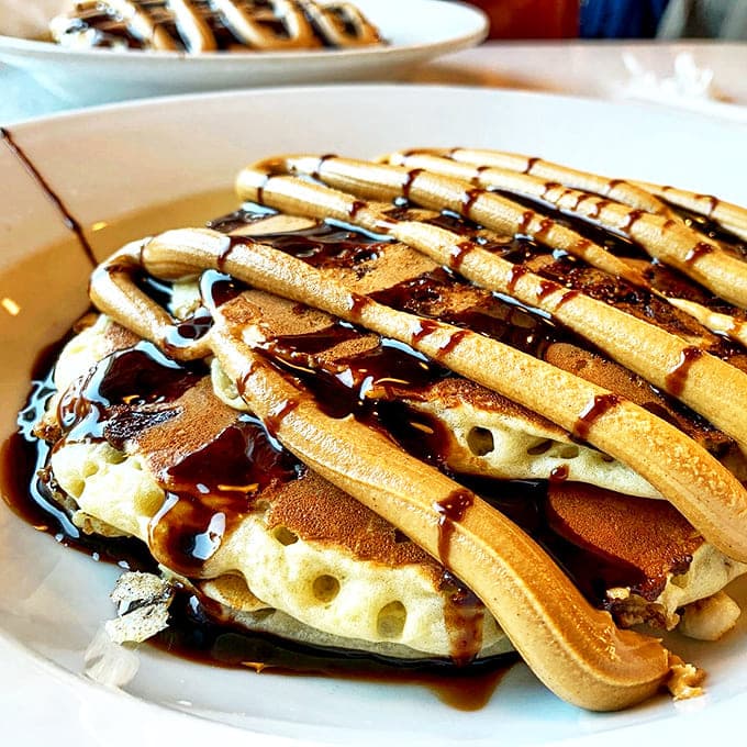 These peanut butter pancakes don't just satisfy hunger – they create happiness, with ribbons of melty goodness that hypnotize before the first bite.