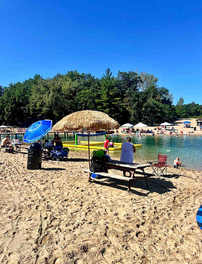 Beach-goers soak up the sun on Pearl Lake's sandy shores, proving you don't need an ocean to create perfect summer memories.