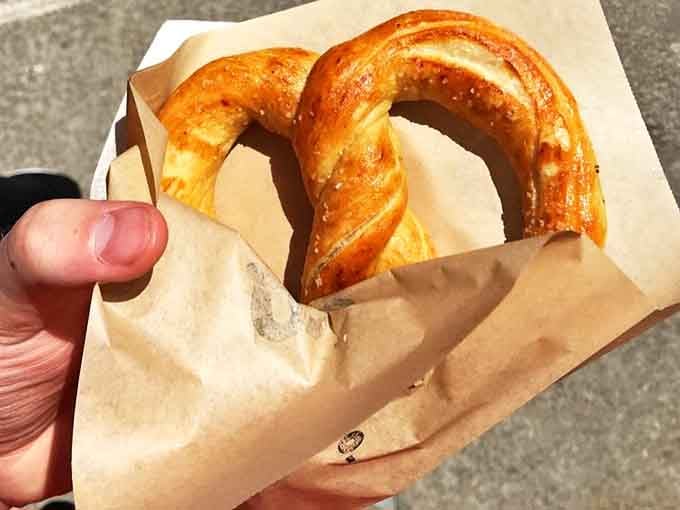Golden-brown perfection wrapped in paper &ndash; this hand-twisted beauty demonstrates why people drive for hours just for one bite.