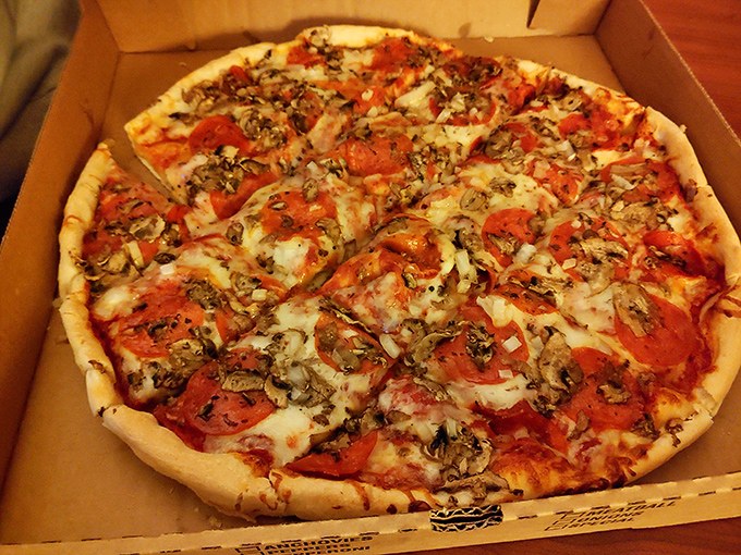 A freshly baked pepperoni and mushroom pizza showcases the perfect balance of sauce, cheese, and toppings that keeps pizza lovers coming back.