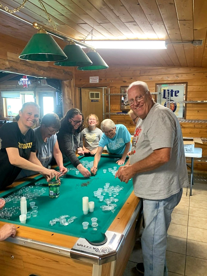 Nothing says "Minnesota bar games" quite like turning a pool table into an impromptu quarters tournament arena.