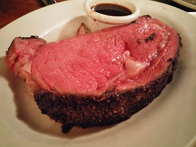 This prime rib isn't just dinner, it's a religious experience – perfectly seasoned crust giving way to a rose-colored interior that melts on contact.