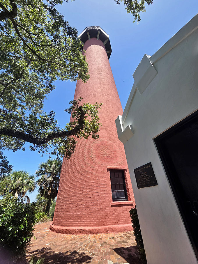 Up close, the lighthouse's brick exterior tells stories of hurricanes weathered and sunsets witnessed through its 160-year vigil.