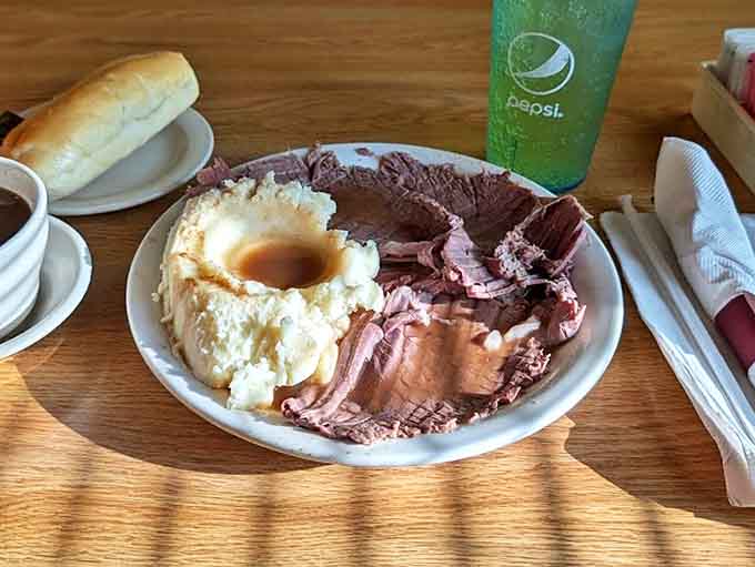 This roast beef plate looks like it could feed a small village, with mashed potatoes creating the perfect landing pad for that gorgeous, glistening gravy.