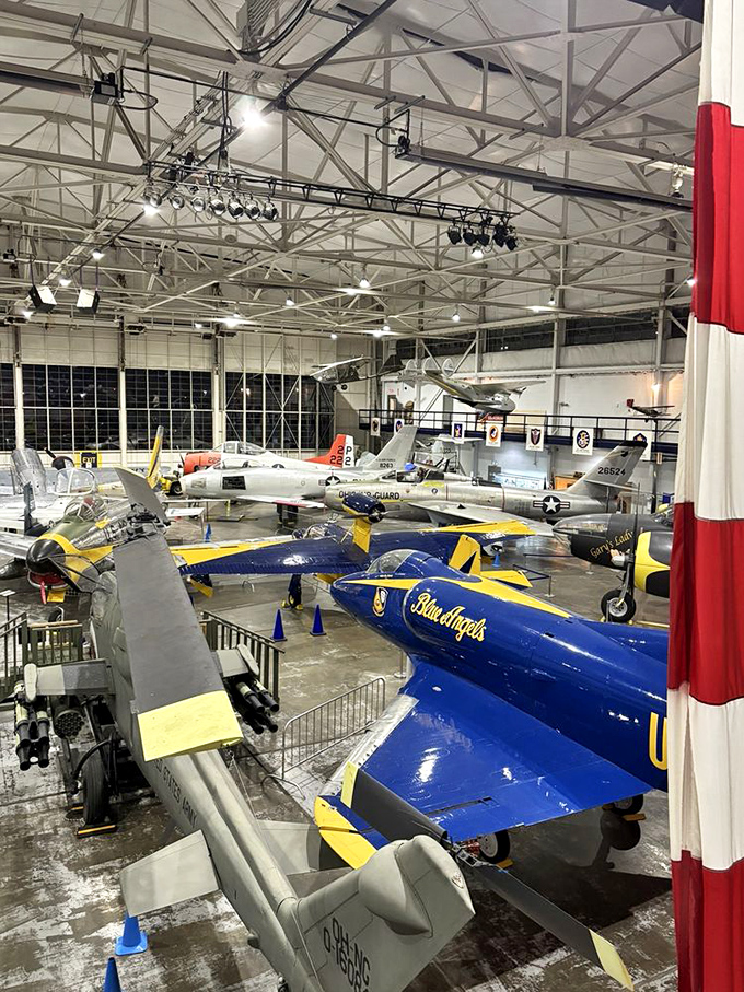 The hangar floor becomes a timeline of aviation evolution, with aircraft from different eras sharing space like old friends at a reunion, each one with tales of adventure to tell.