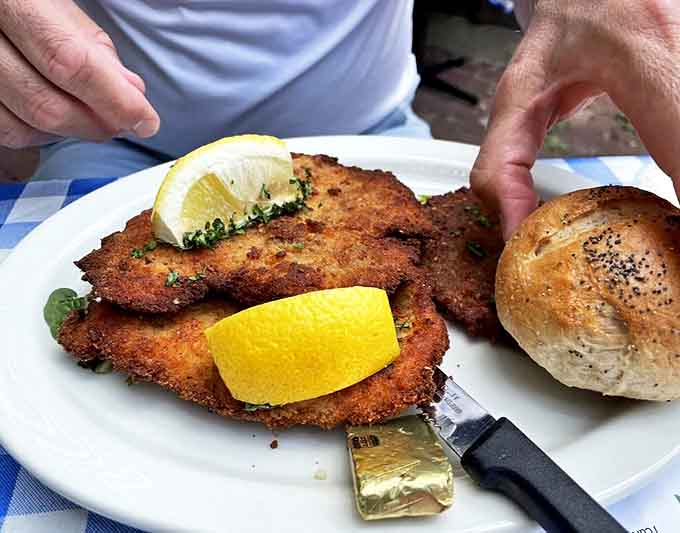 Golden, crispy schnitzel that shatters with each bite, served with bright lemon wedges&mdash;this is the dish that launched a thousand return visits.