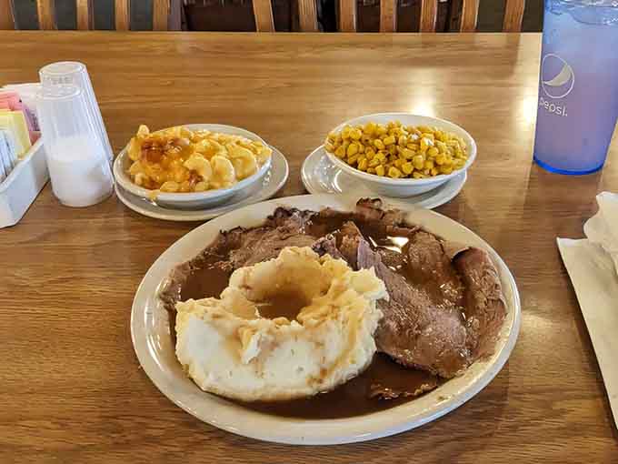 Behold the glory: tender roast beef swimming in rich gravy, flanked by creamy mashed potatoes and sweet corn that'll make you forget vegetables were ever boring.