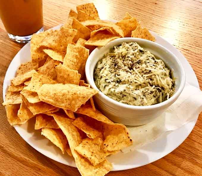 Creamy, herbaceous dip surrounded by a crispy chip armada &ndash; a perfect companion for one-handed reading adventures.