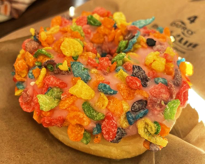 
This isn't just any strawberry donut &ndash; it's a carnival of color and texture with crunchy cereal creating a playful contrast to the soft, sweet dough beneath.