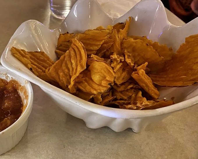 These aren't your average potato chips! Crispy sweet potato slices deliver a tropical twist on bar snacks, perfect for between-sip munching.