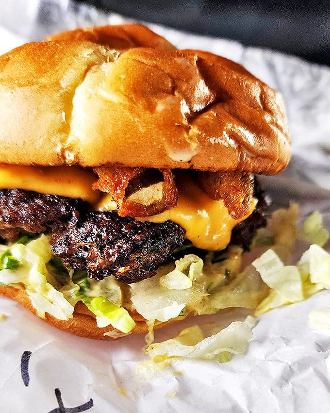 Behold the burger that makes fast food chains weep with envy &ndash; melted cheese cascading over a perfectly grilled patty like dairy lava.