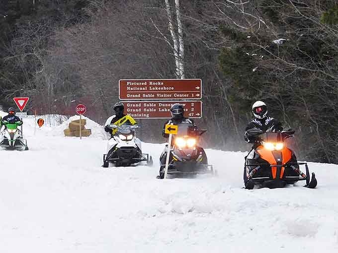 Snowmobilers find their paradise on H-58 during winter months, when engines purr and tracks create temporary signatures in the fresh powder.