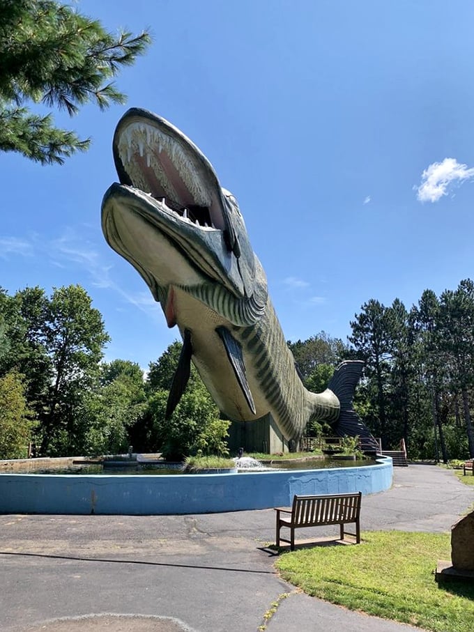 The muskie's gaping jaws create a unique observation platform where visitors can stand and survey the grounds.