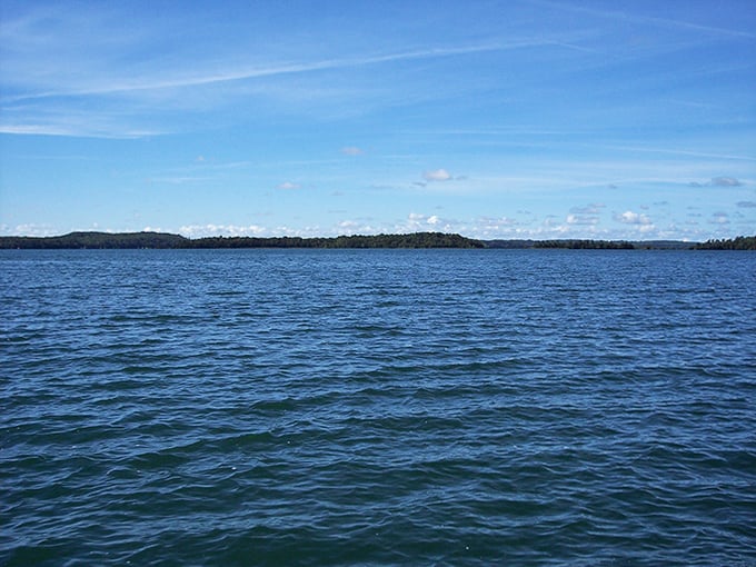 Endless blue stretches to the horizon, where Deer Lake's famous clarity creates an optical illusion of Caribbean waters in the North Woods.