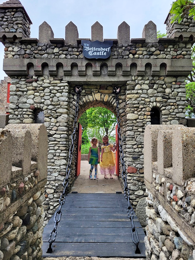 "Who goes there?" The castle's entrance gate stands ready with chains and stonework that would make any medieval architect tip their hat in approval.