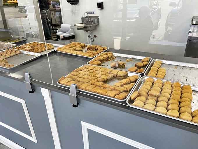 Trays of honey-soaked, nut-filled happiness await the wise customer who knows that "just one piece" is a mathematical impossibility.