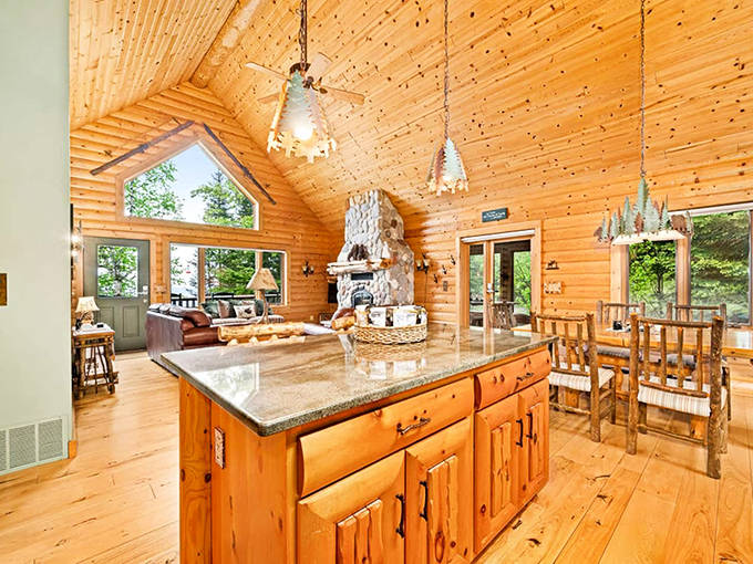 Pendant lights shaped like pine trees hang from honey-colored ceilings, proving someone really thought about every single detail here.
