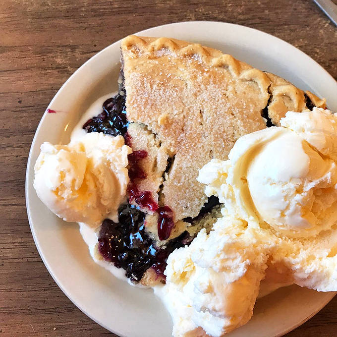 A slice of blueberry pie crowned with melting ice cream &ndash; proof that heaven exists and it's located in Shakopee, Minnesota.