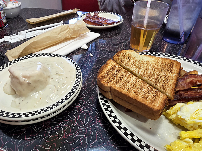 Nothing says "good morning" like a plate of eggs, bacon, and toast that could feed a small army – comfort food that hugs you from the inside out.