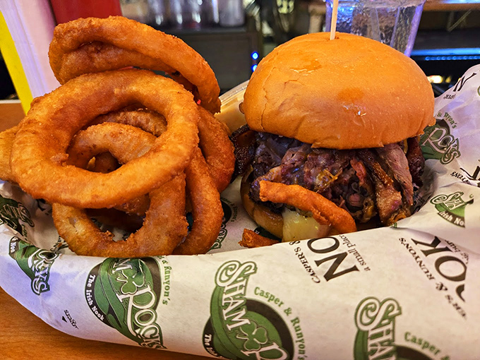 Burger perfection: A towering creation served alongside golden onion rings that could double as bracelets for the truly food-committed.