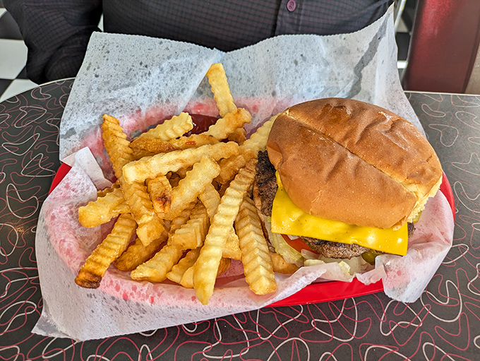 The signature cheeseburger and crinkle-cut fries arrive like old friends you've missed desperately &ndash; simple perfection that makes you wonder why anyone bothers with fancy food.