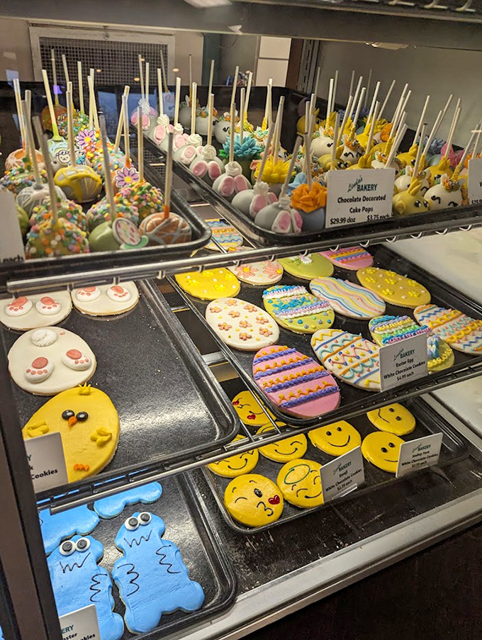 Colorful cake pops and decorated cookies bring whimsy and artistry to the bakery's impressive selection.