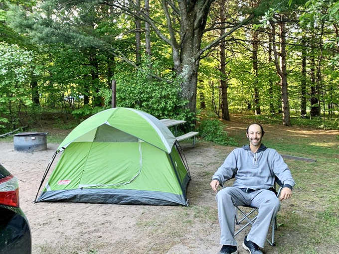 Camping nirvana achieved: a simple tent, a comfortable chair, and the kind of peace you can't download from an app.