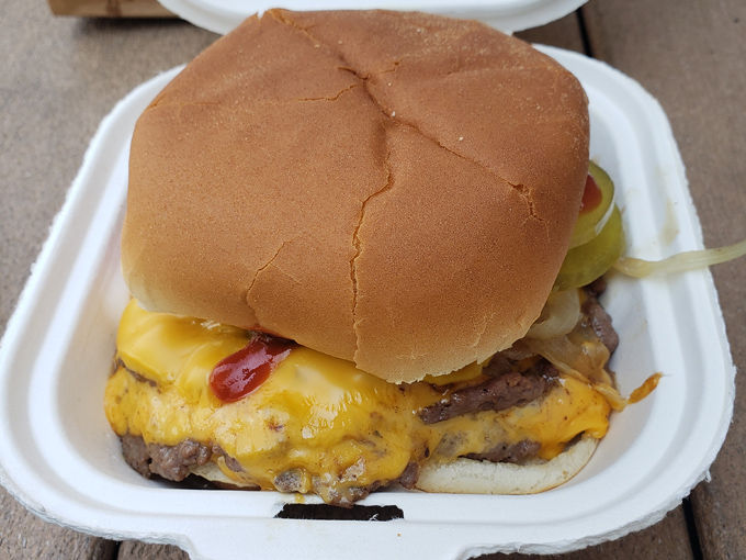 Behold the star of the show &ndash; a perfectly smashed patty with that coveted crispy edge, melty cheese cascading like a yellow waterfall.