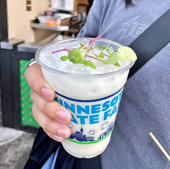 This isn't just any refreshment &ndash; it's a coconut lychee colada that tastes like a vacation in a cup, garnished with fresh mint for that extra touch.