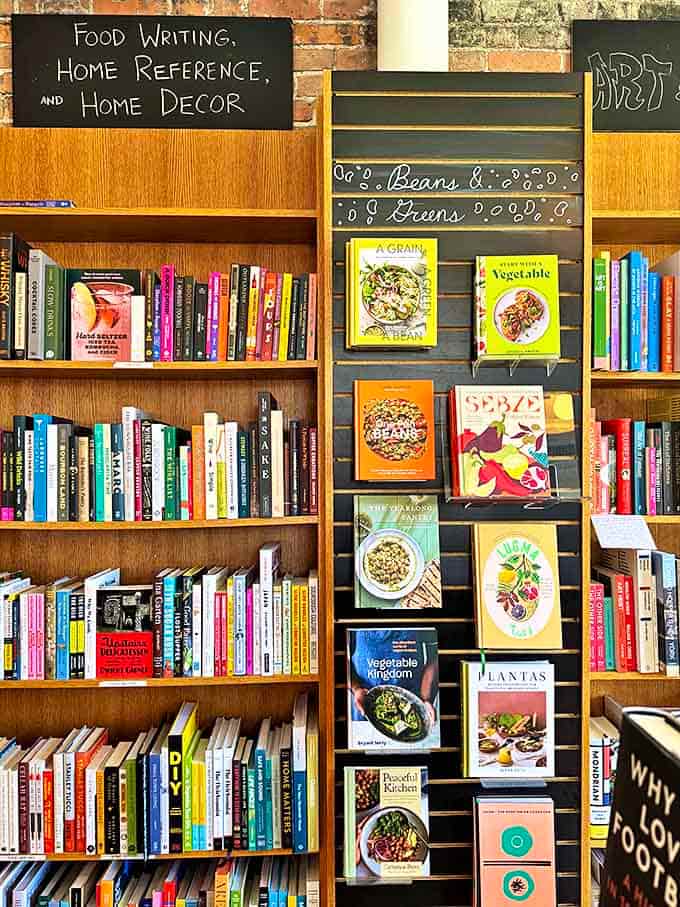 The cookbook section promises culinary adventures between covers, organized with the care of someone who knows beans from greens.