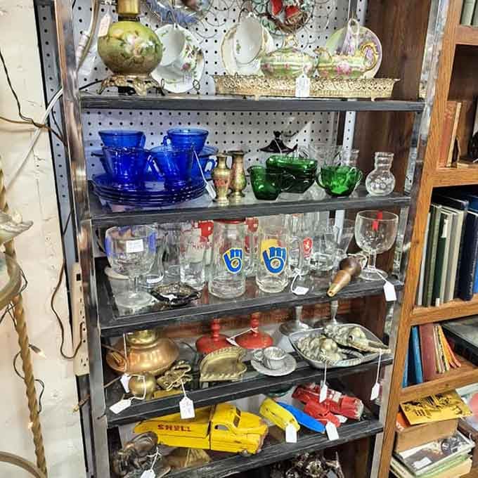 Delicate pink depression glass catches the light alongside elegant crystal decanters, turning ordinary beverages into special occasions since the 1930s.