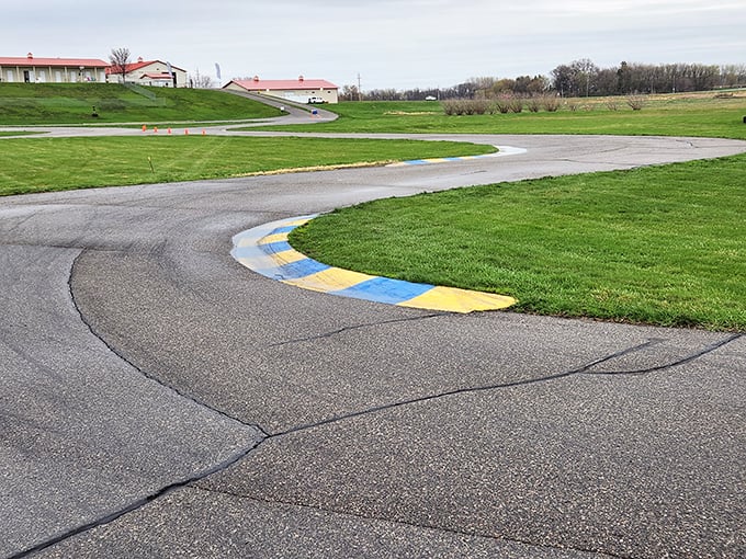 Every curve presents a new challenge, with colored markers guiding drivers through the racing line's optimal path.