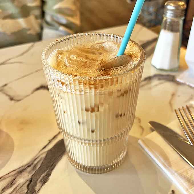 This isn't just coffee – it's liquid inspiration served in a ridged glass, the perfect companion to whatever story you're exploring.