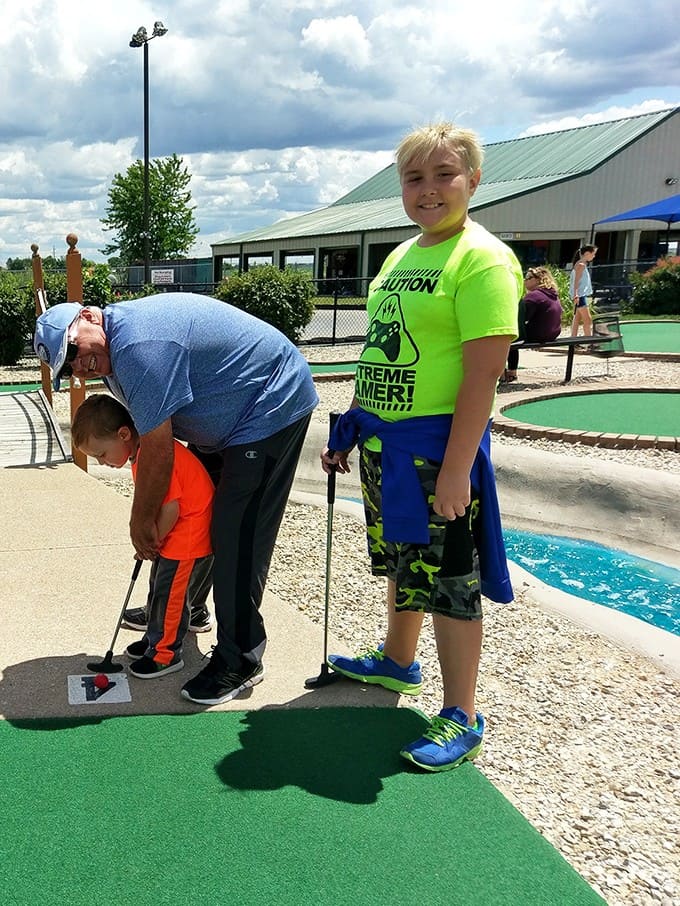 Multi-generational bonding happens naturally here, where putting skills matter more than age and everyone's equally terrible at that windmill hole.