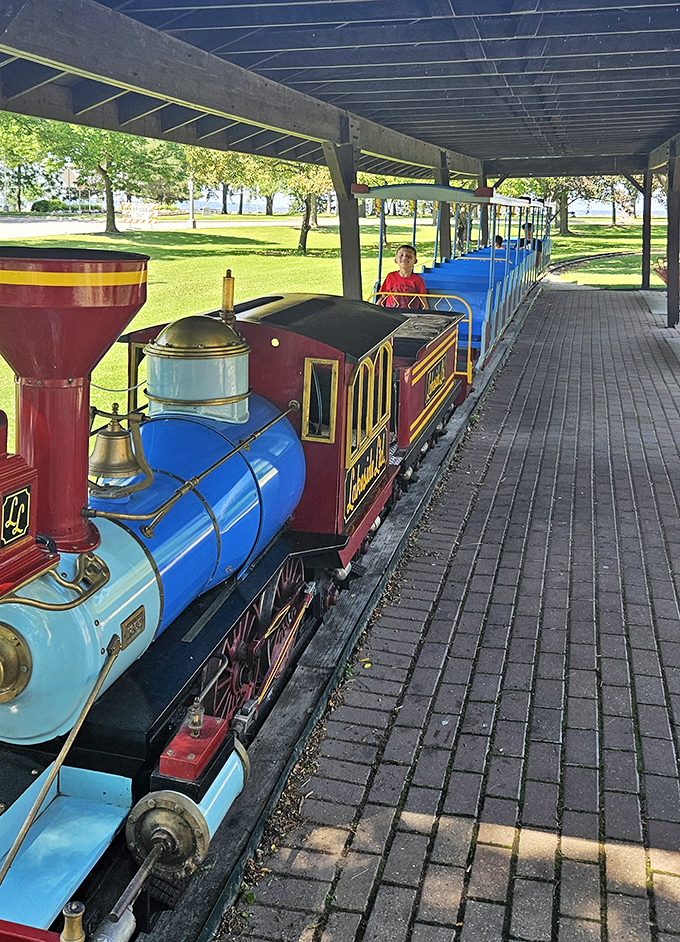 All aboard! This miniature marvel chugs through the park delivering outsized joy, proving the best adventures sometimes come in small packages.