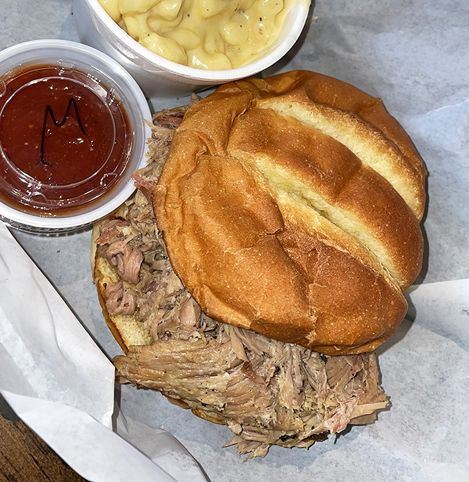 Tender strands of smoky pork piled high on a pillowy bun &ndash; simplicity elevated to art form.